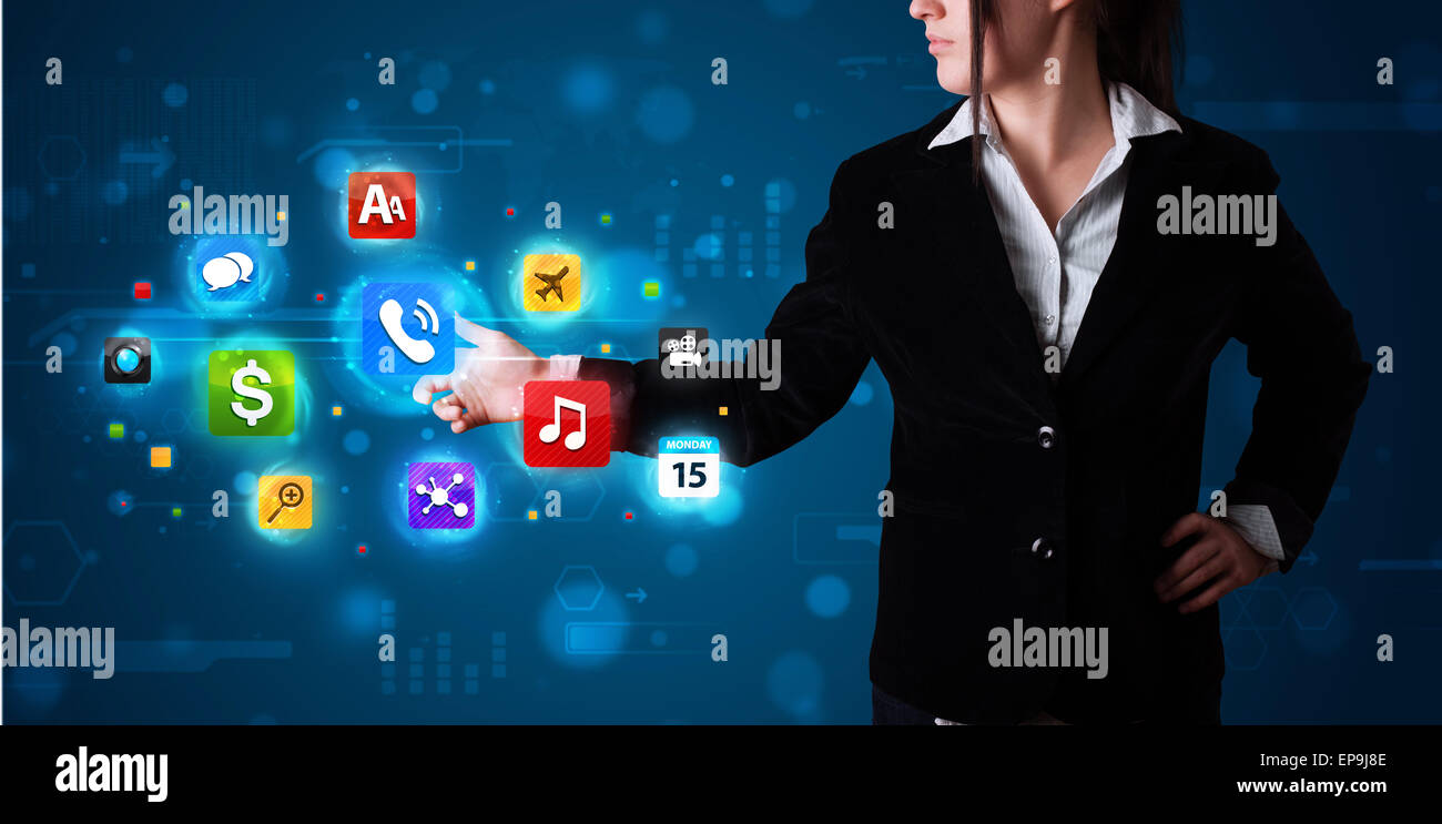 Woman pressing various collection of high tech buttons Stock Photo - Alamy
