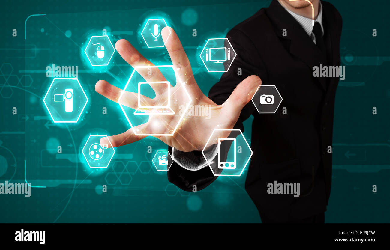 Businessman pressing virtual media type of buttons Stock Photo - Alamy