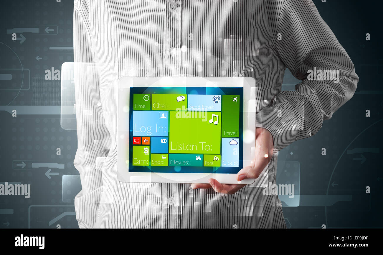 Businessman holding a tablet with modern software operational system ...