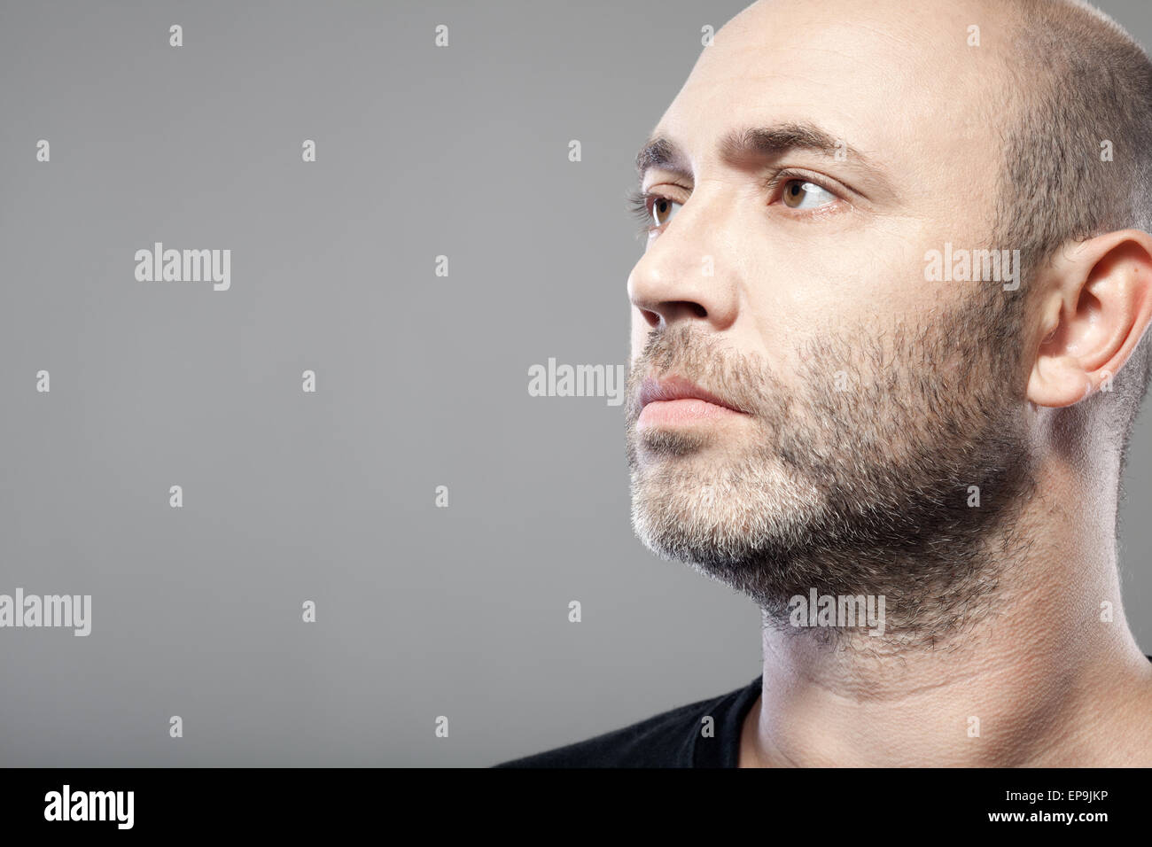 man look into the distance isolated on gray Stock Photo - Alamy