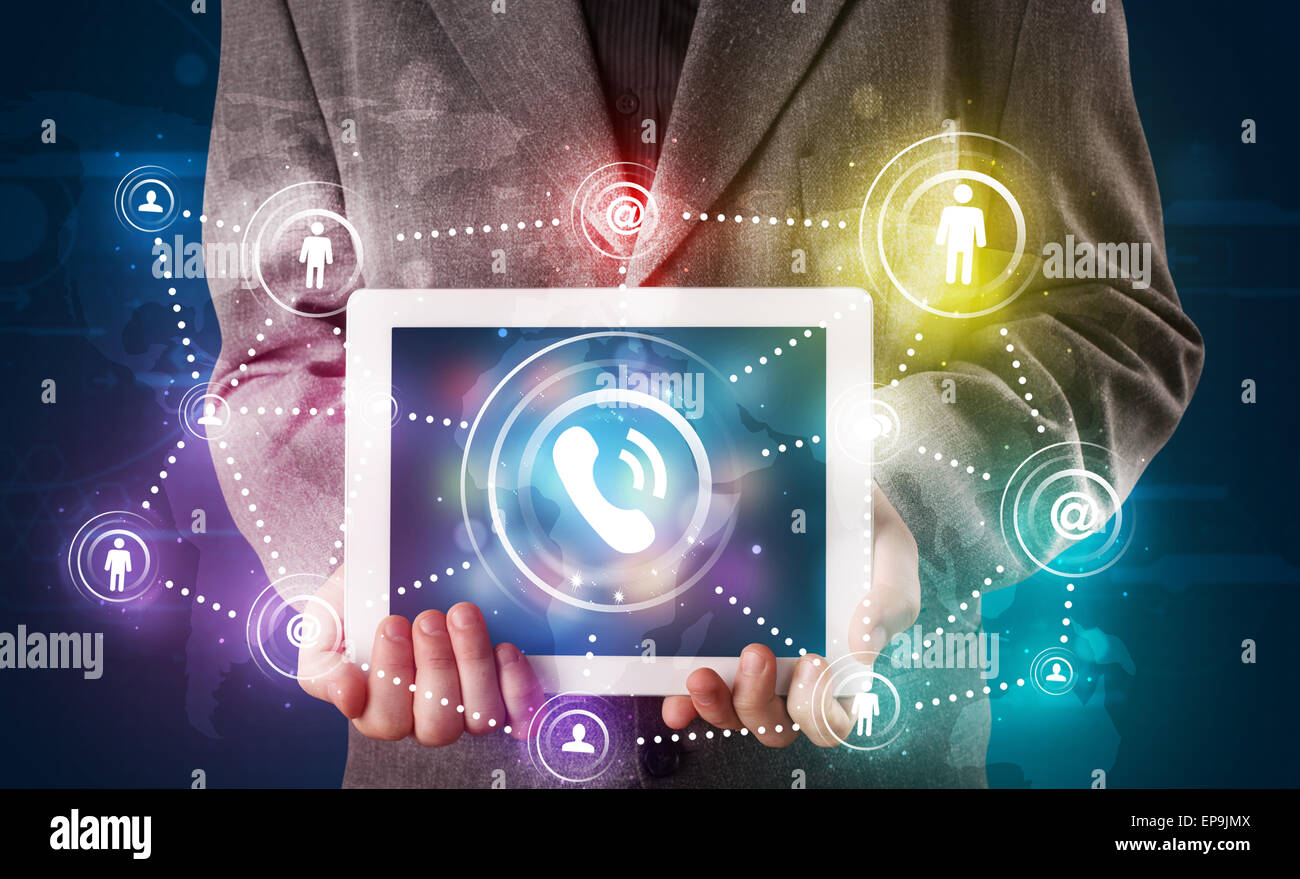 Businessman showing social networking technology with colorful lights ...