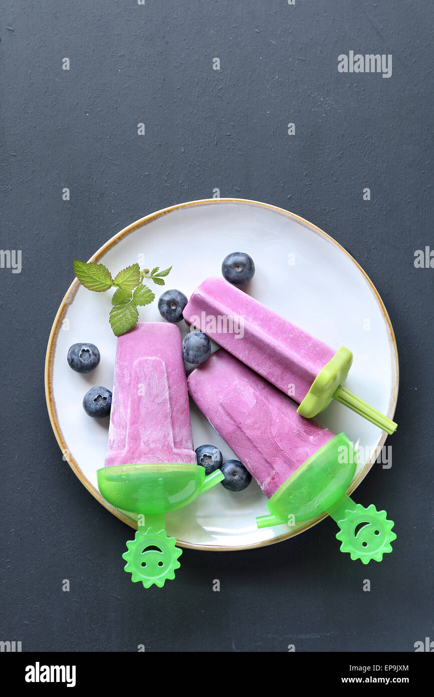Blueberry popsicle ice lollipop Stock Photo - Alamy