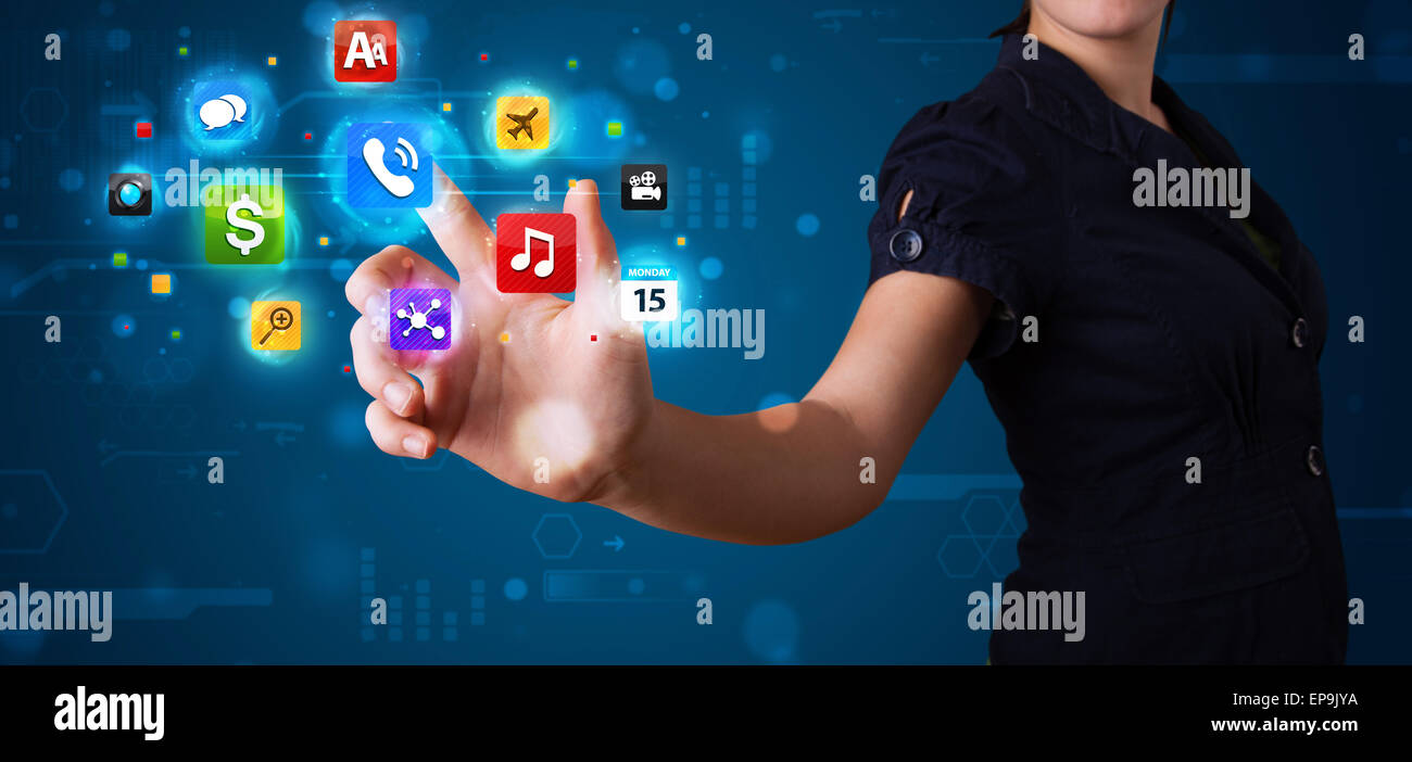 Woman pressing various collection of high tech buttons Stock Photo - Alamy