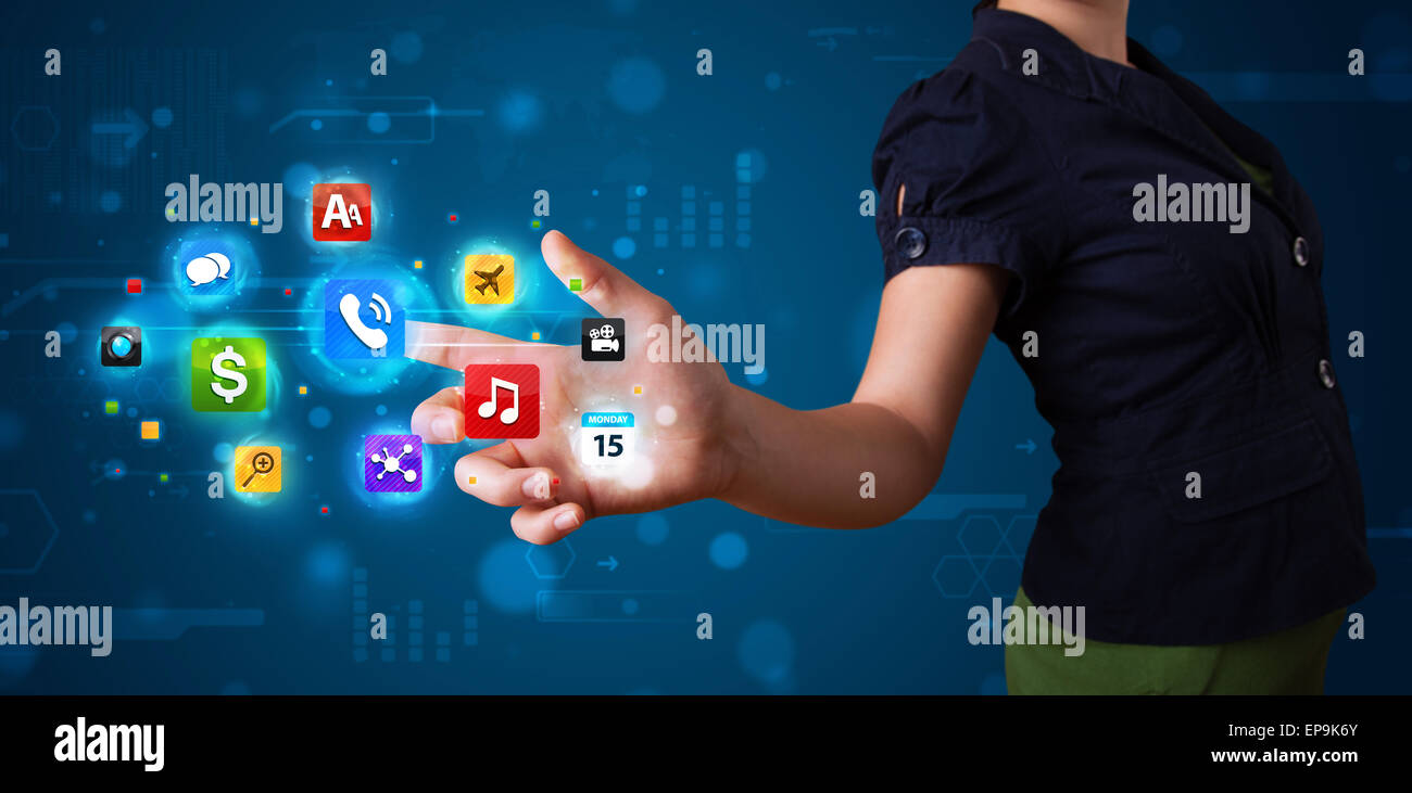 Woman pressing various collection of high tech buttons Stock Photo - Alamy