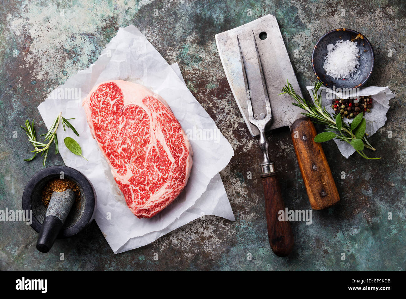 Raw fresh marbled meat Black Angus Steak Ribeye and seasonings on metal ...