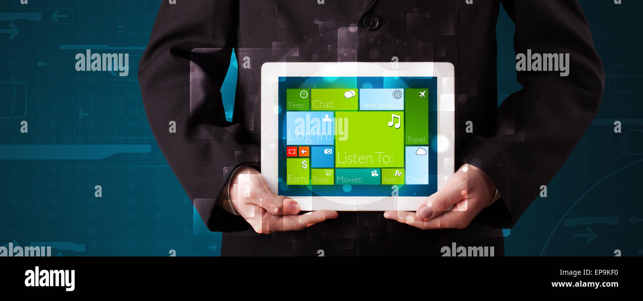 Businessman holding a tablet with modern software operational system ...