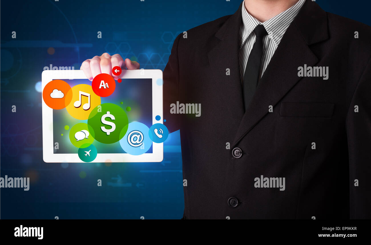 Businessman presenting colorful modern signs Stock Photo - Alamy