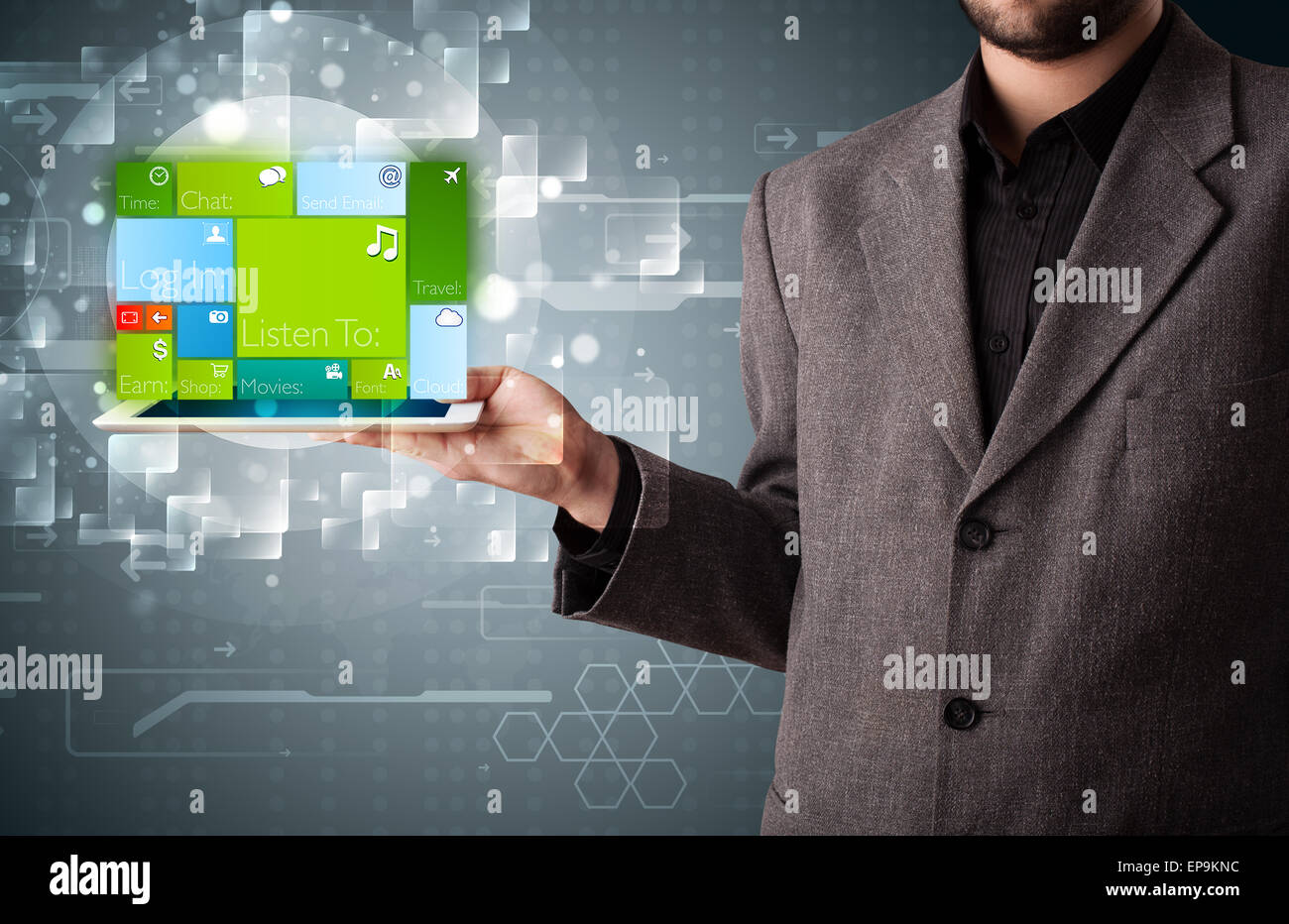 Businessman holding a tablet with modern software operational system ...