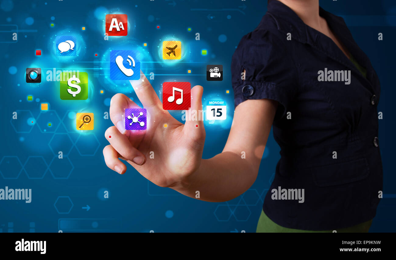 Woman pressing various collection of high tech buttons Stock Photo - Alamy