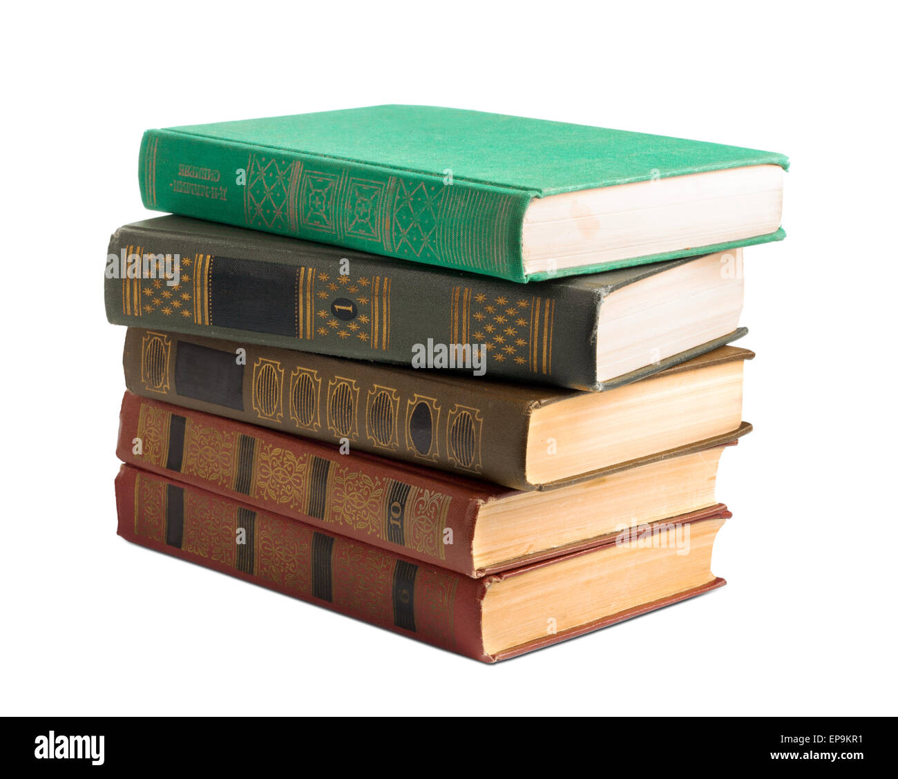 A stack of old books with gold stamping on a white background isolated ...