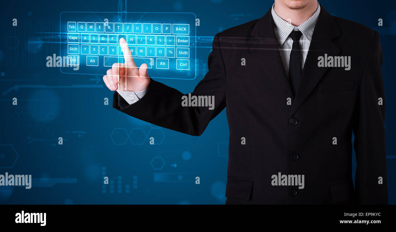Businessman pressing virtual type of keyboard Stock Photo - Alamy