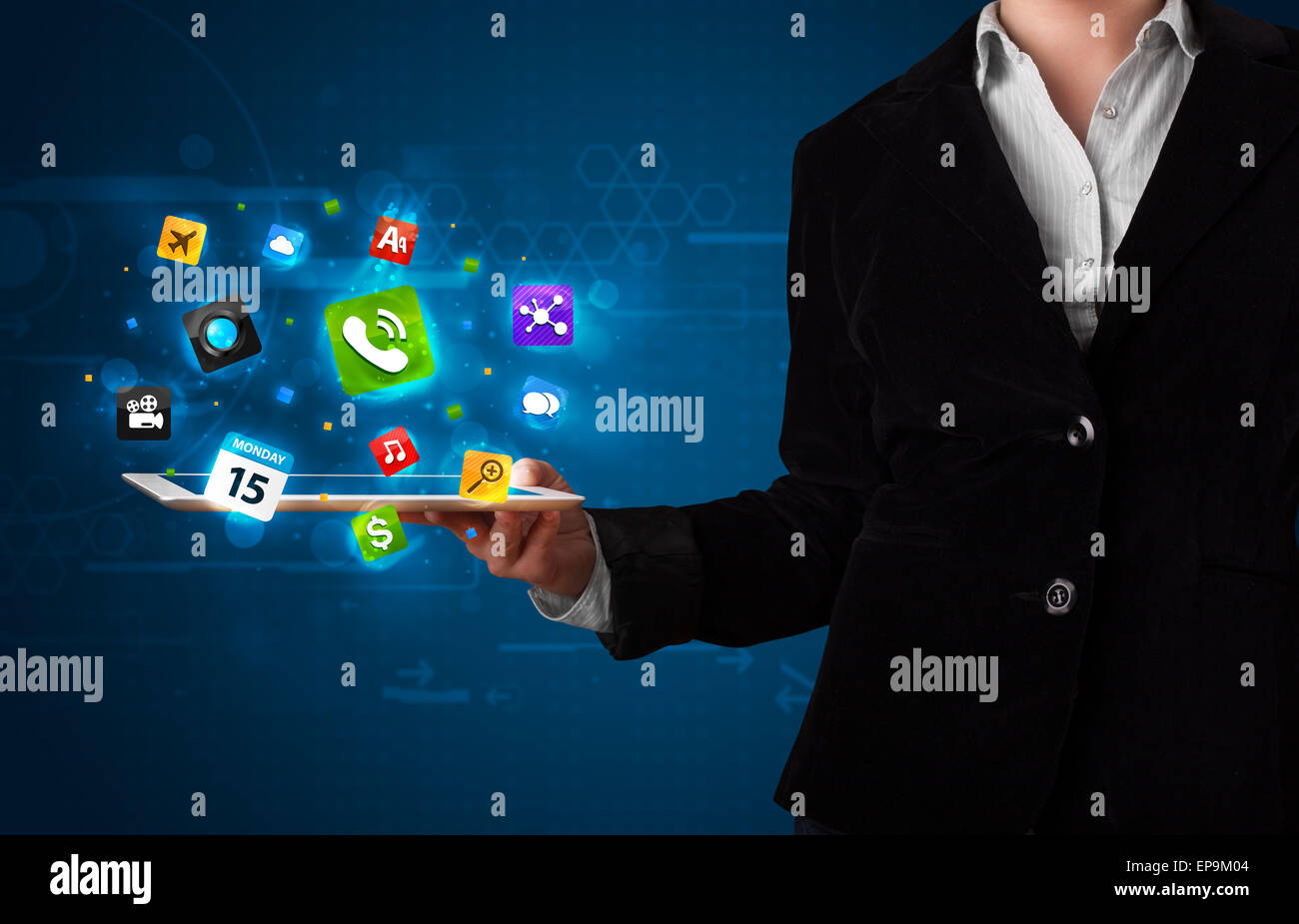 Lady holding a tablet with modern colorful apps and icons Stock Photo ...