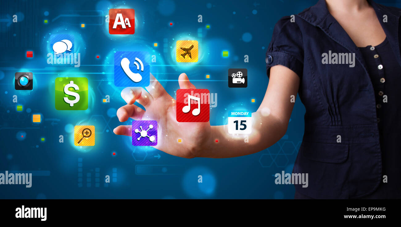 Woman pressing various collection of high tech buttons Stock Photo - Alamy