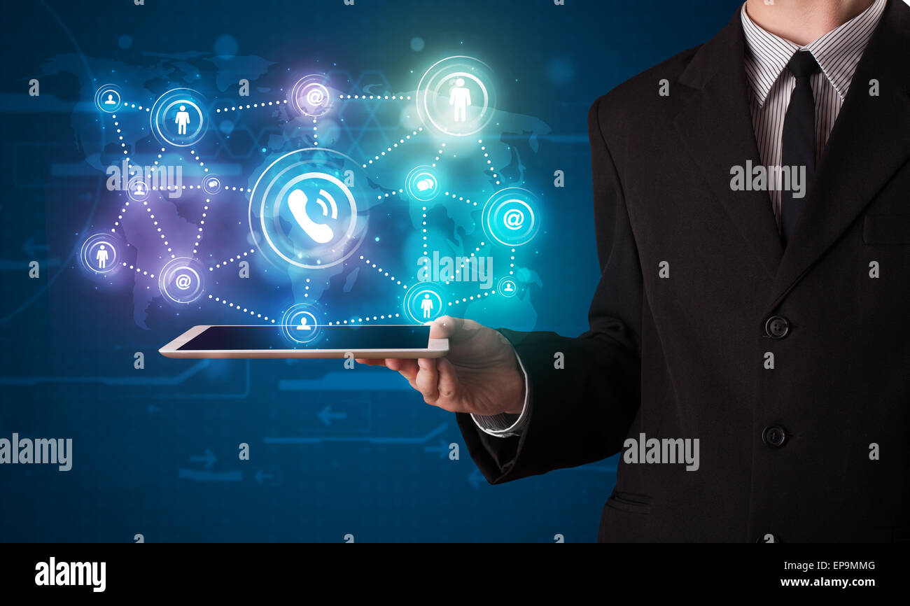 Businessman showing social networking technology with colorful lights ...