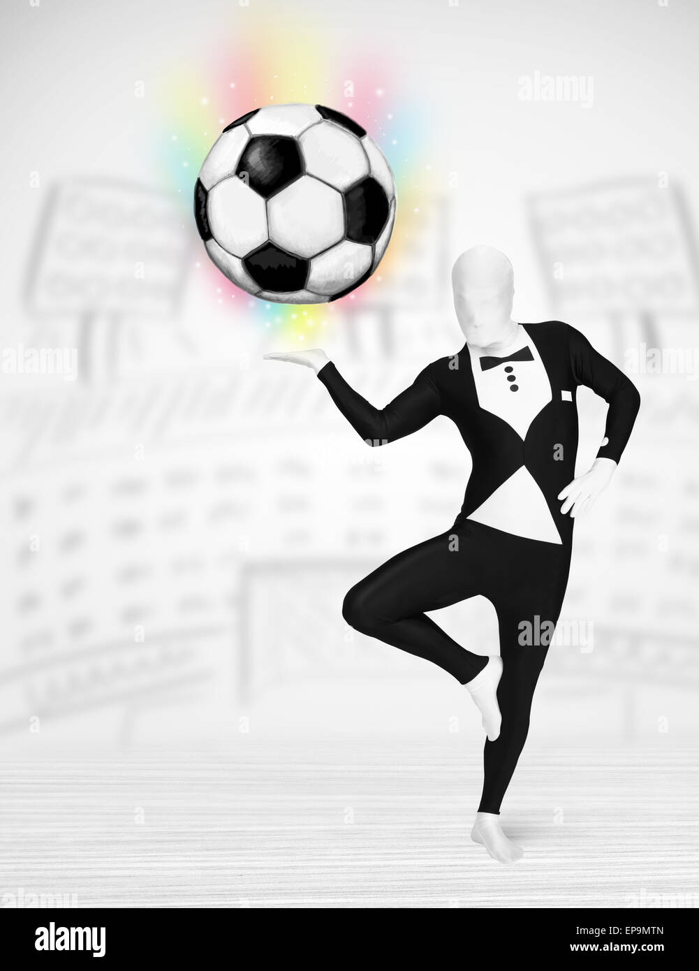 man in full body suit holdig soccer ball Stock Photo - Alamy