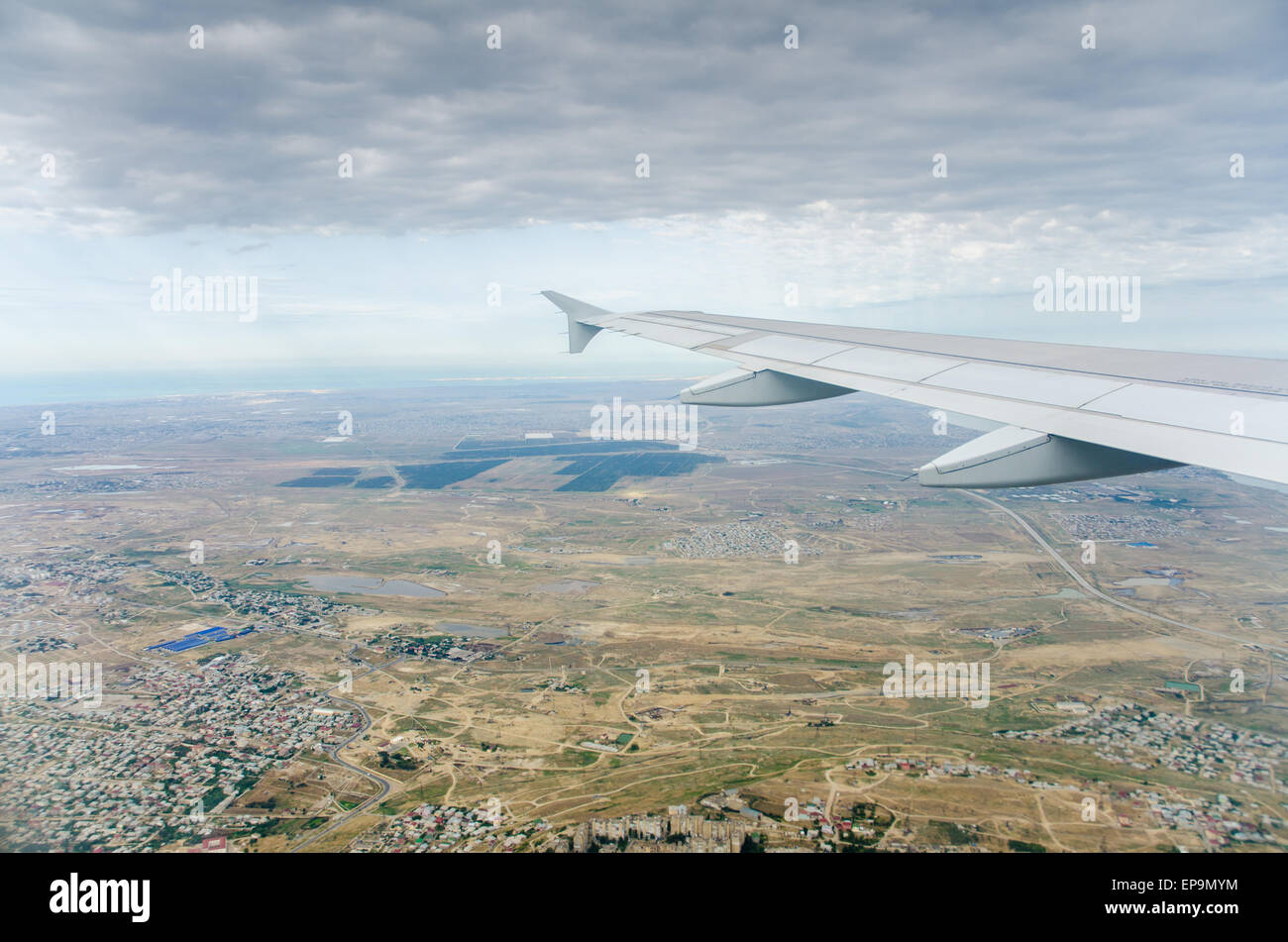 Airplane wing out of window Stock Photo - Alamy