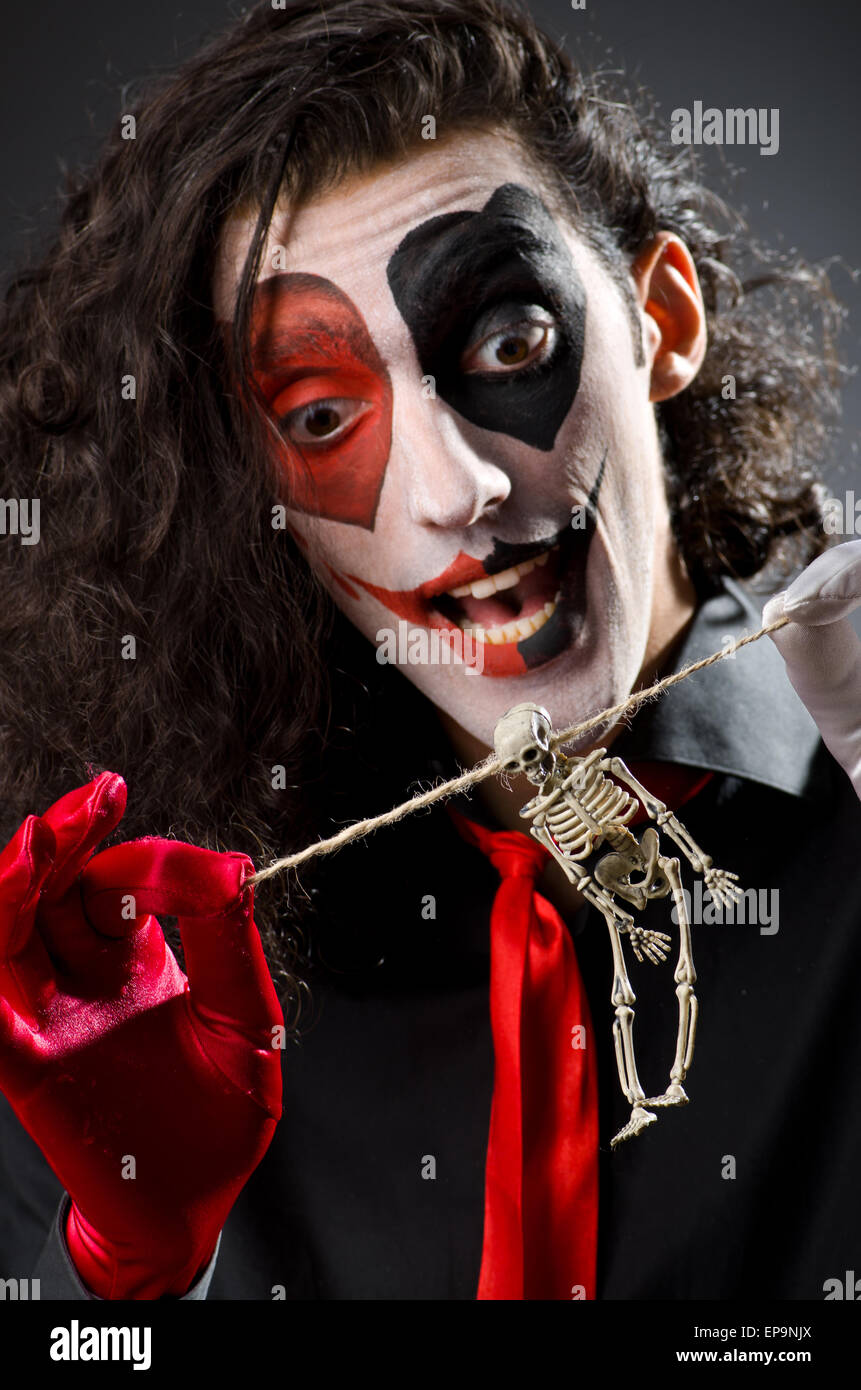Funny man with skeleton in hands Stock Photo - Alamy