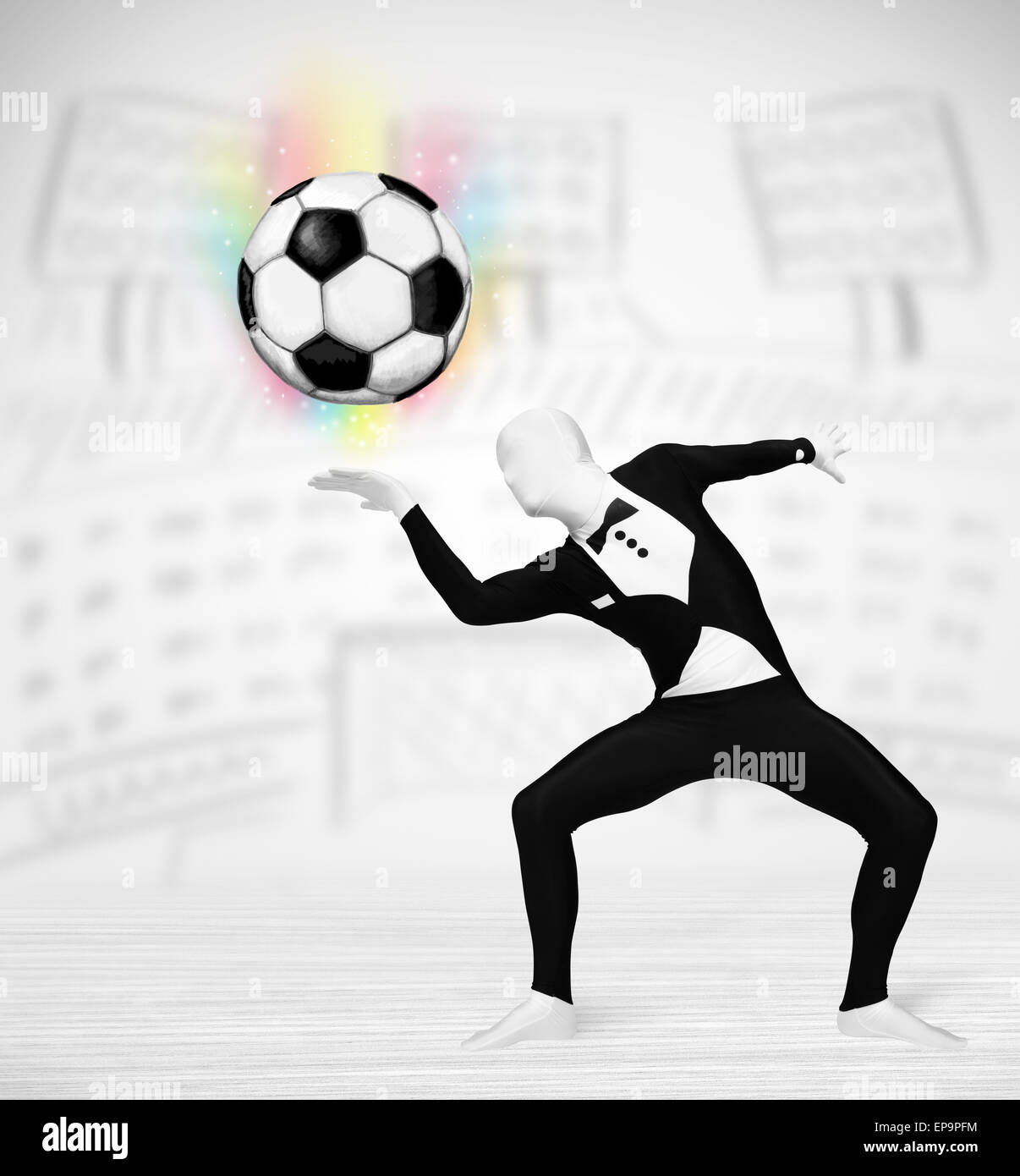 man in full body suit holdig soccer ball Stock Photo - Alamy