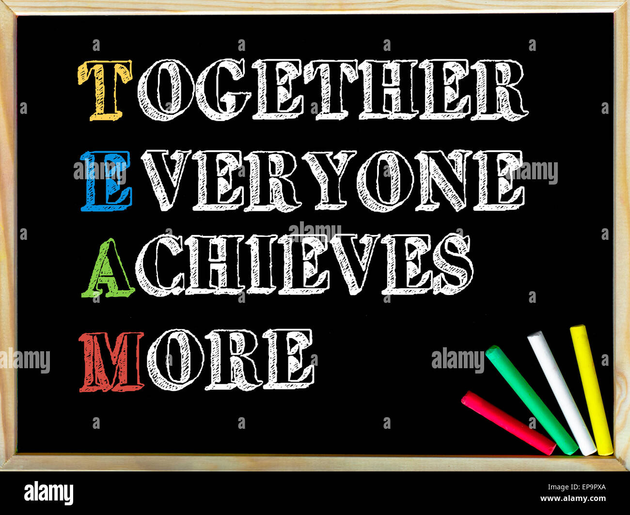 Acronym TEAM as Together Everyone Achieves More. Written note on wooden ...