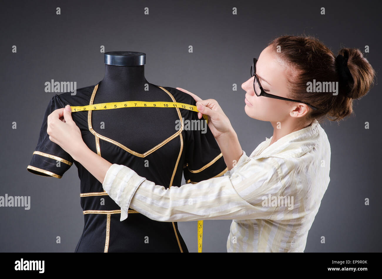 Woman tailor working on clothing Stock Photo - Alamy