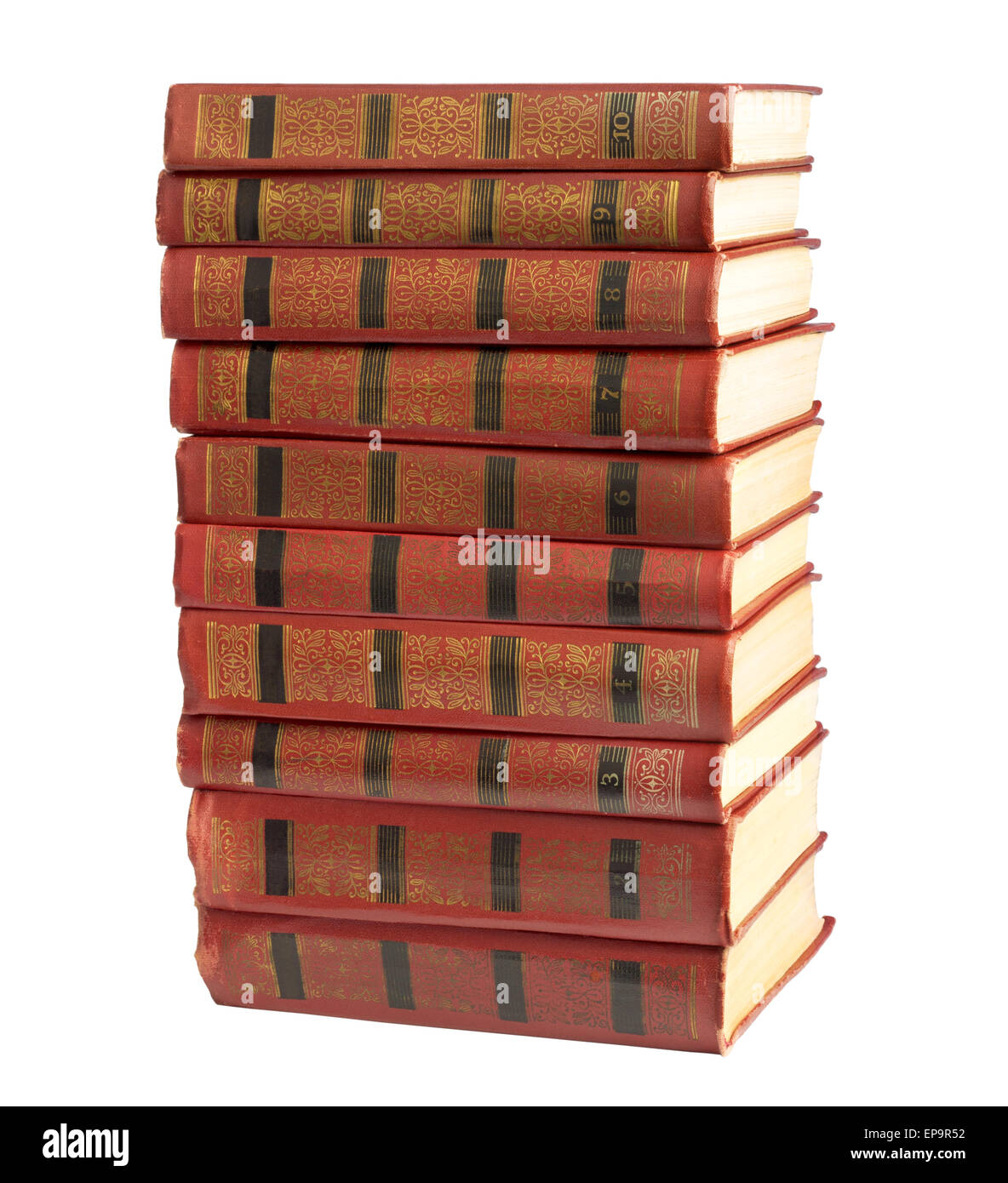 A stack of old books with gold stamping on a white background isolated ...