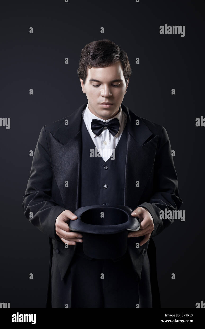 magician showing tricks with top hat isolated Stock Photo - Alamy