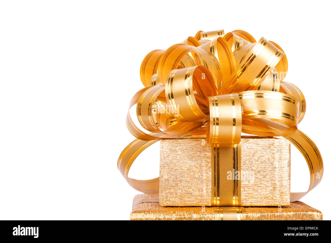 Beautiful Gift box in gold wrapping paper isolated on a white ...