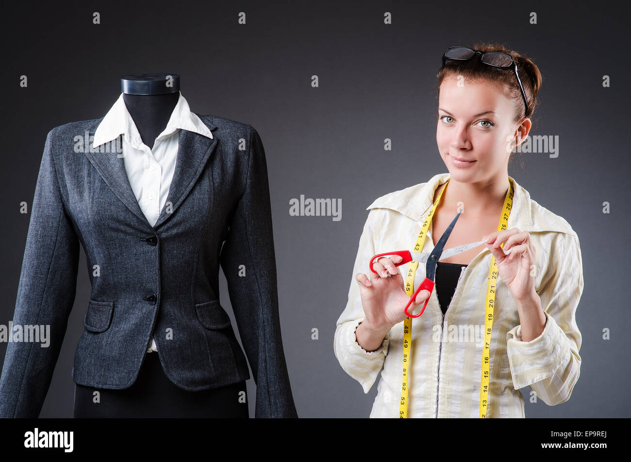 Woman tailor working on clothing Stock Photo - Alamy