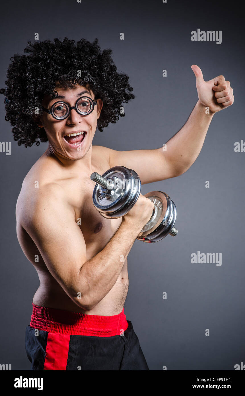 Funny man exercising with dumbbells Stock Photo - Alamy