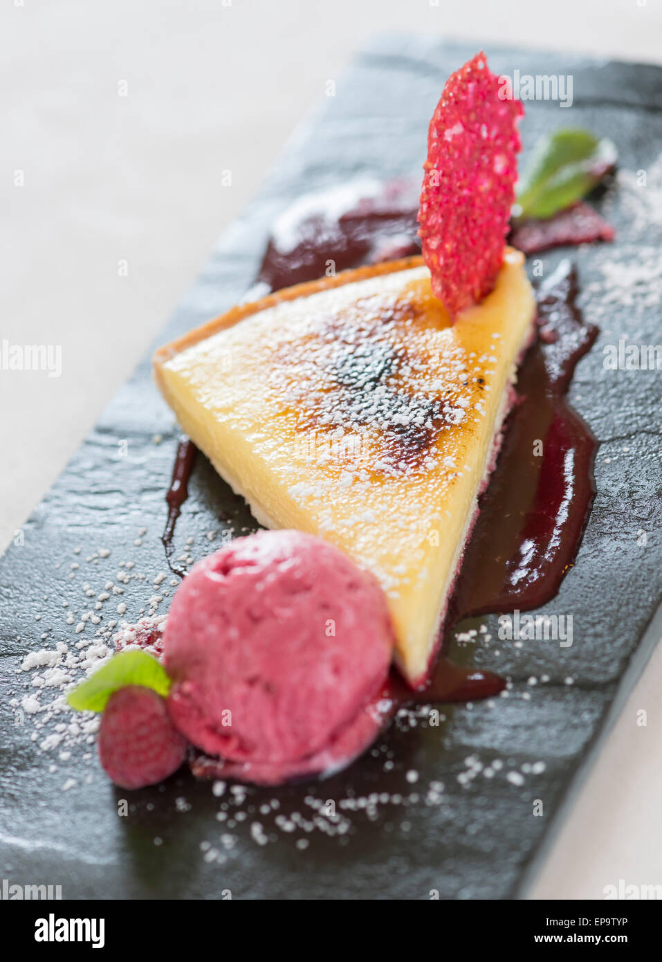 Creme Brulee Slice with raspberry ice cream Stock Photo - Alamy