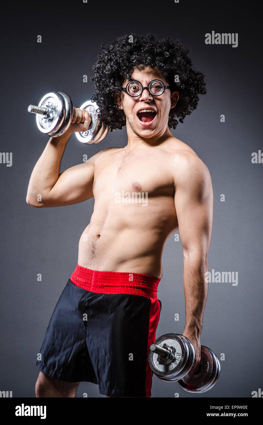 Funny man exercising with dumbbells Stock Photo - Alamy