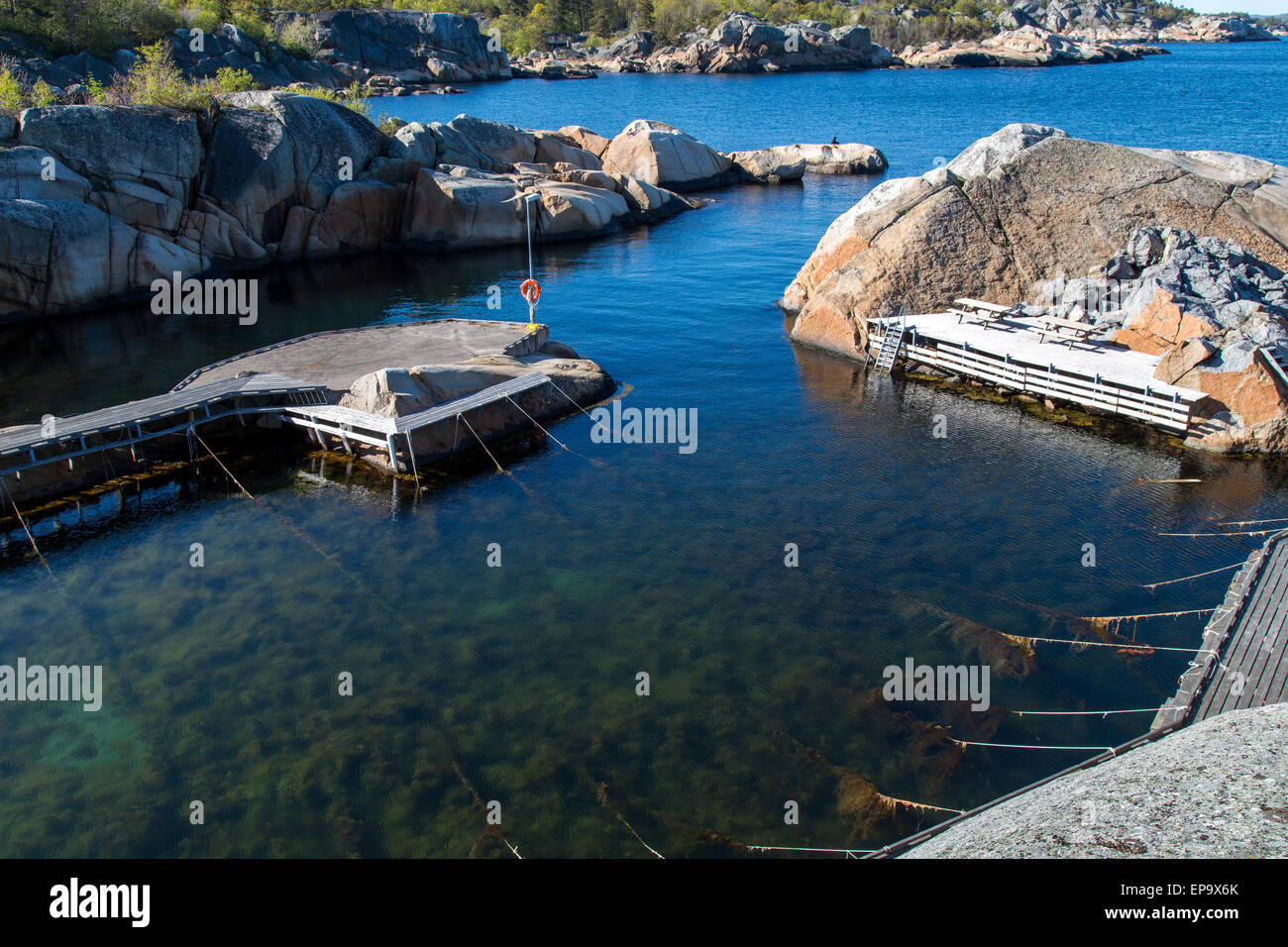 Natural harbour in a fjord with decking and moorings Stock Photo - Alamy