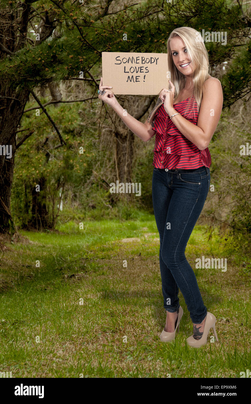 Woman Holding an Inspirational Sign Stock Photo - Alamy