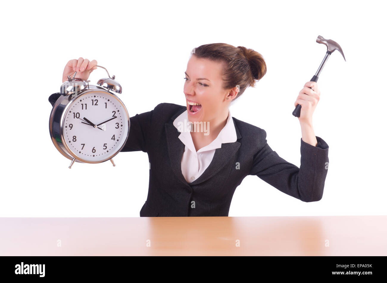 Woman trying to break the clock Stock Photo - Alamy
