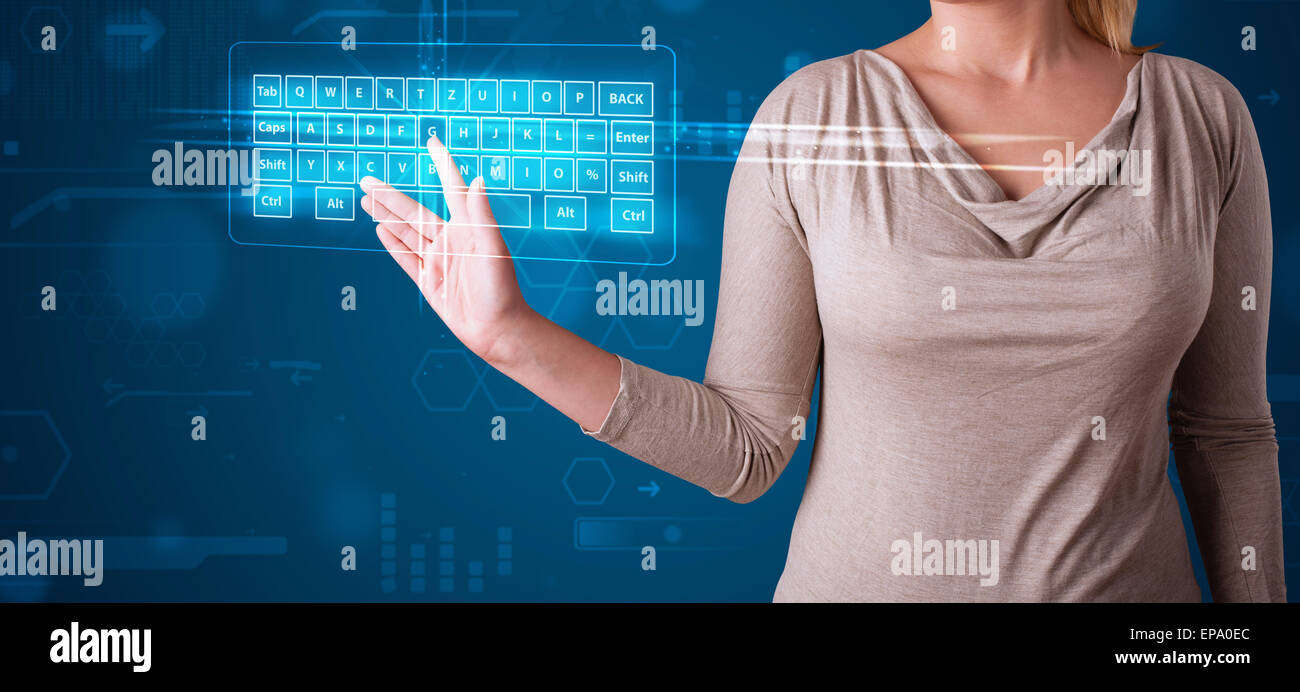 Girl pressing virtual type of keyboard Stock Photo - Alamy