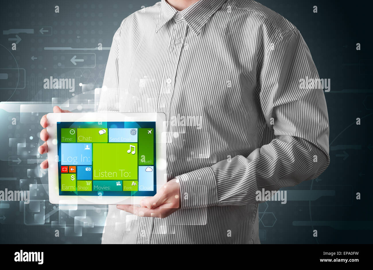 Businessman holding a tablet with modern software operational system ...