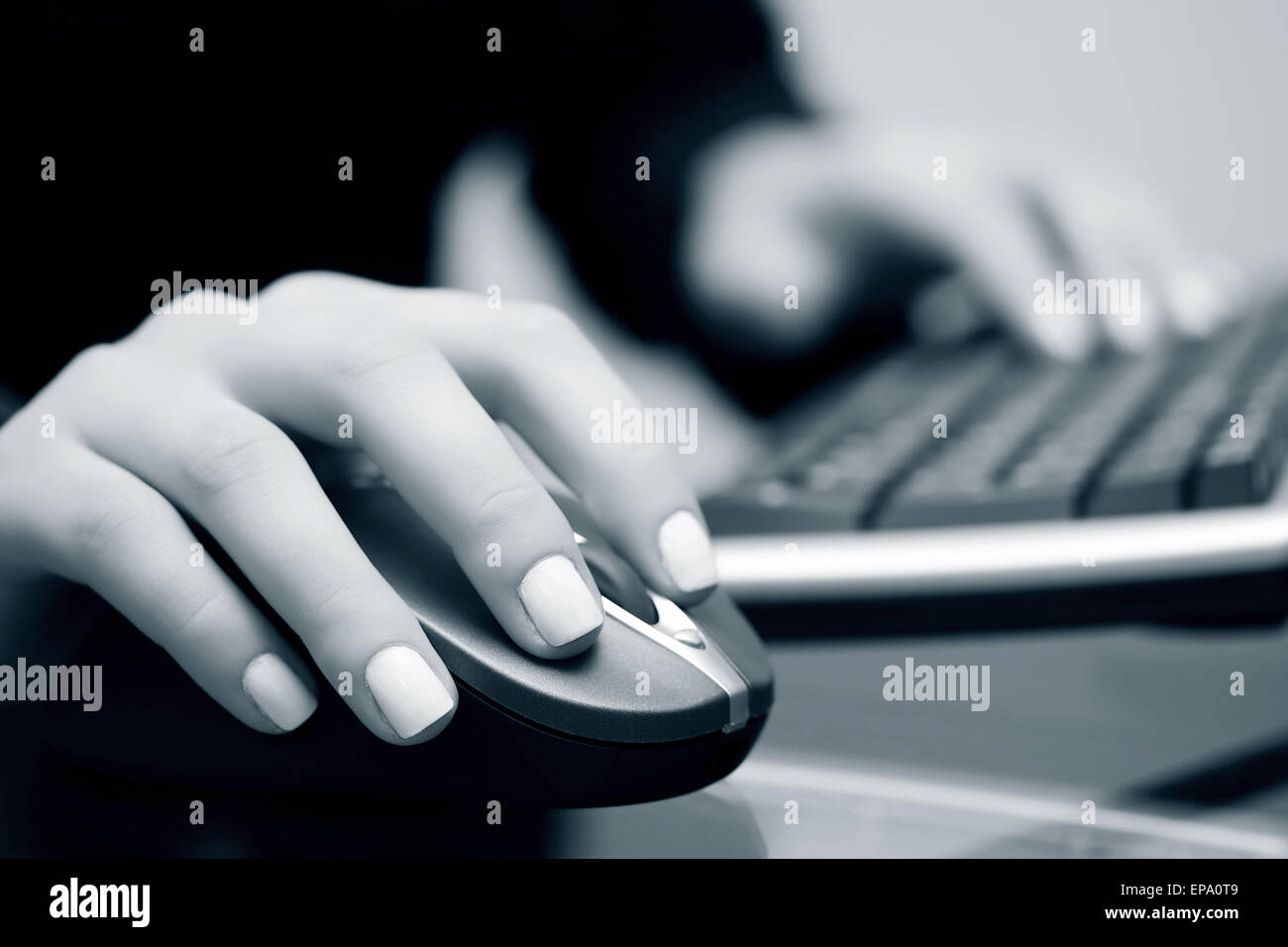 Female hands using computer mouse and keyboard Stock Photo - Alamy