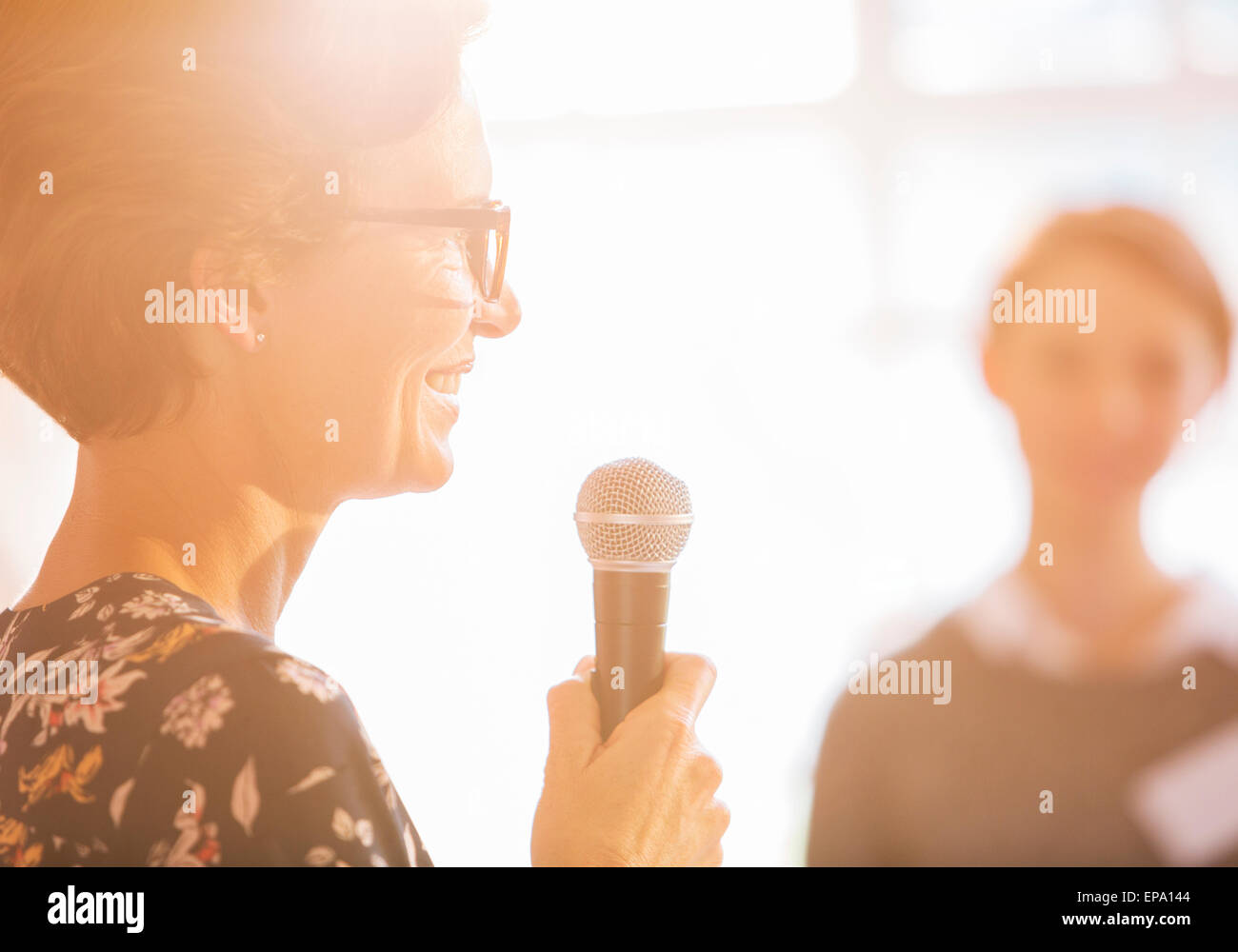 close up woman talking microphone Stock Photo - Alamy