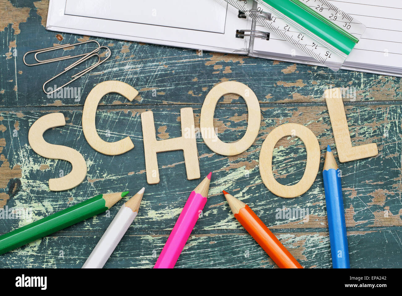 School written with wooden letters and school items on rustic wood ...