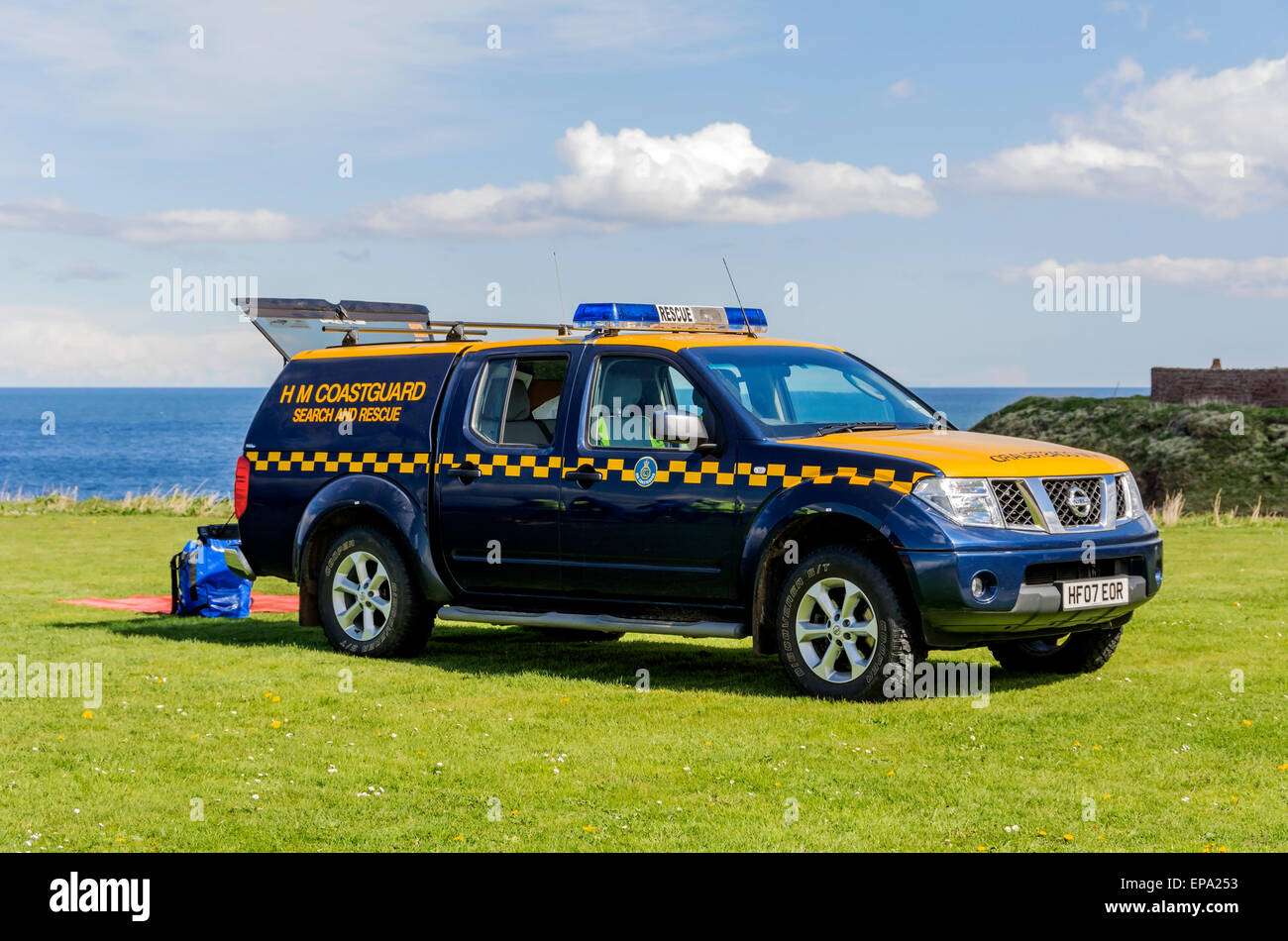 A coastguard rescue emergency vehicle parked on the clifftop near ...