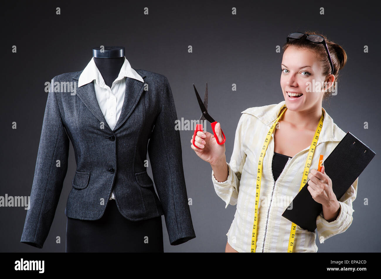 Woman tailor working on clothing Stock Photo - Alamy
