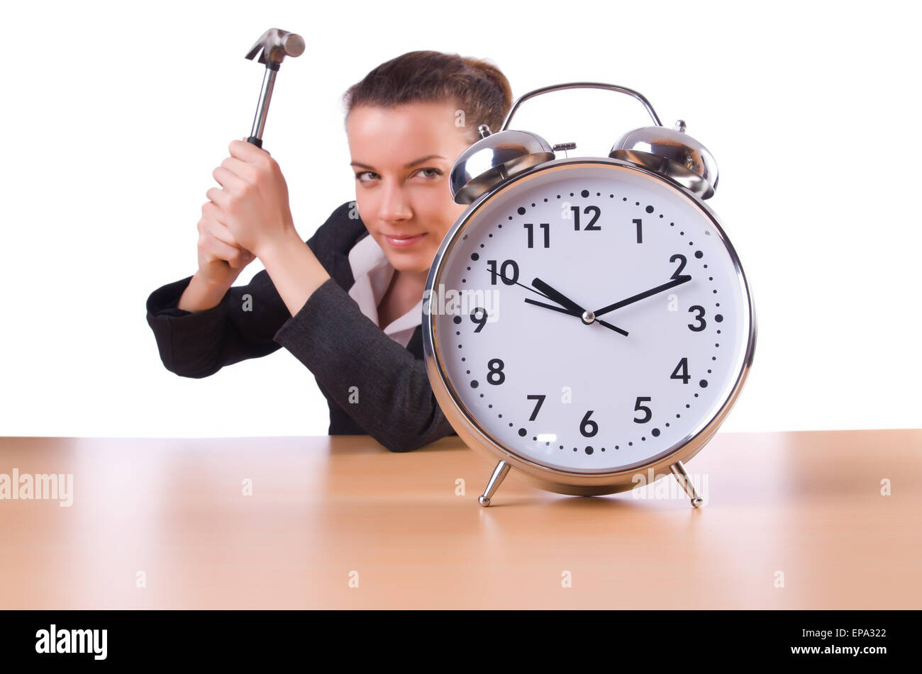 Woman trying to break the clock Stock Photo - Alamy