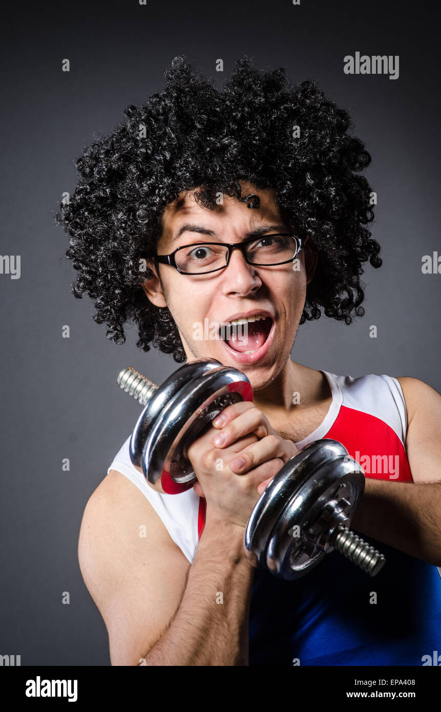 Funny man exercising with dumbbells Stock Photo - Alamy