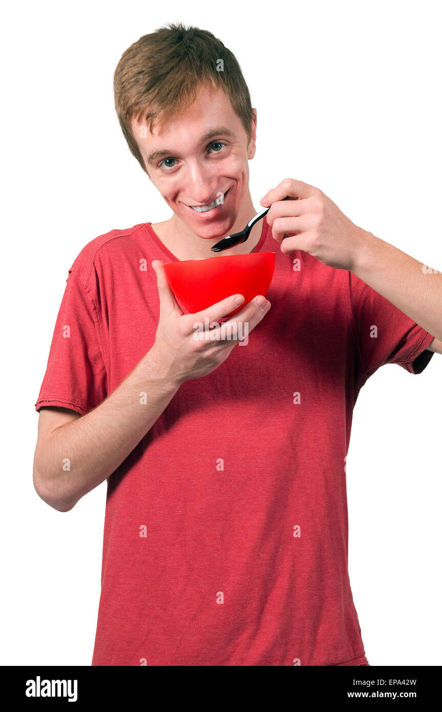 Man, happy, eating with spoon hi-res stock photography and images - Alamy