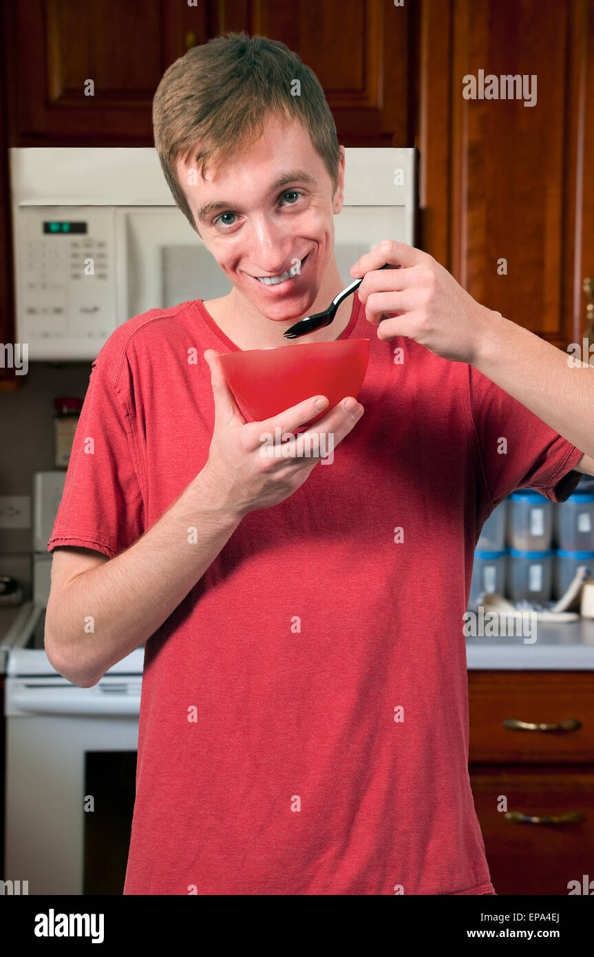 Handsome young man eating cereal hi-res stock photography and images ...