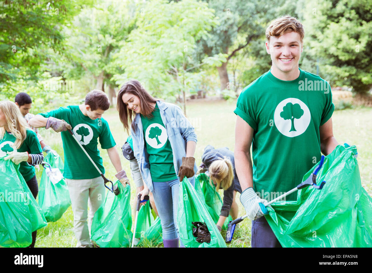 environmentalist volunteer picking up trash Stock Photo - Alamy