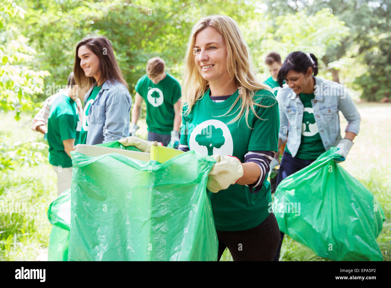 environmentalist volunteer picking up trash Stock Photo - Alamy