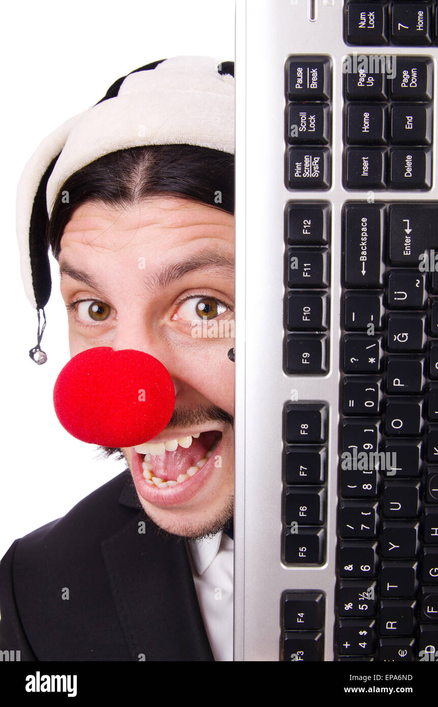 Funny clown with keyboard isolated on white Stock Photo - Alamy