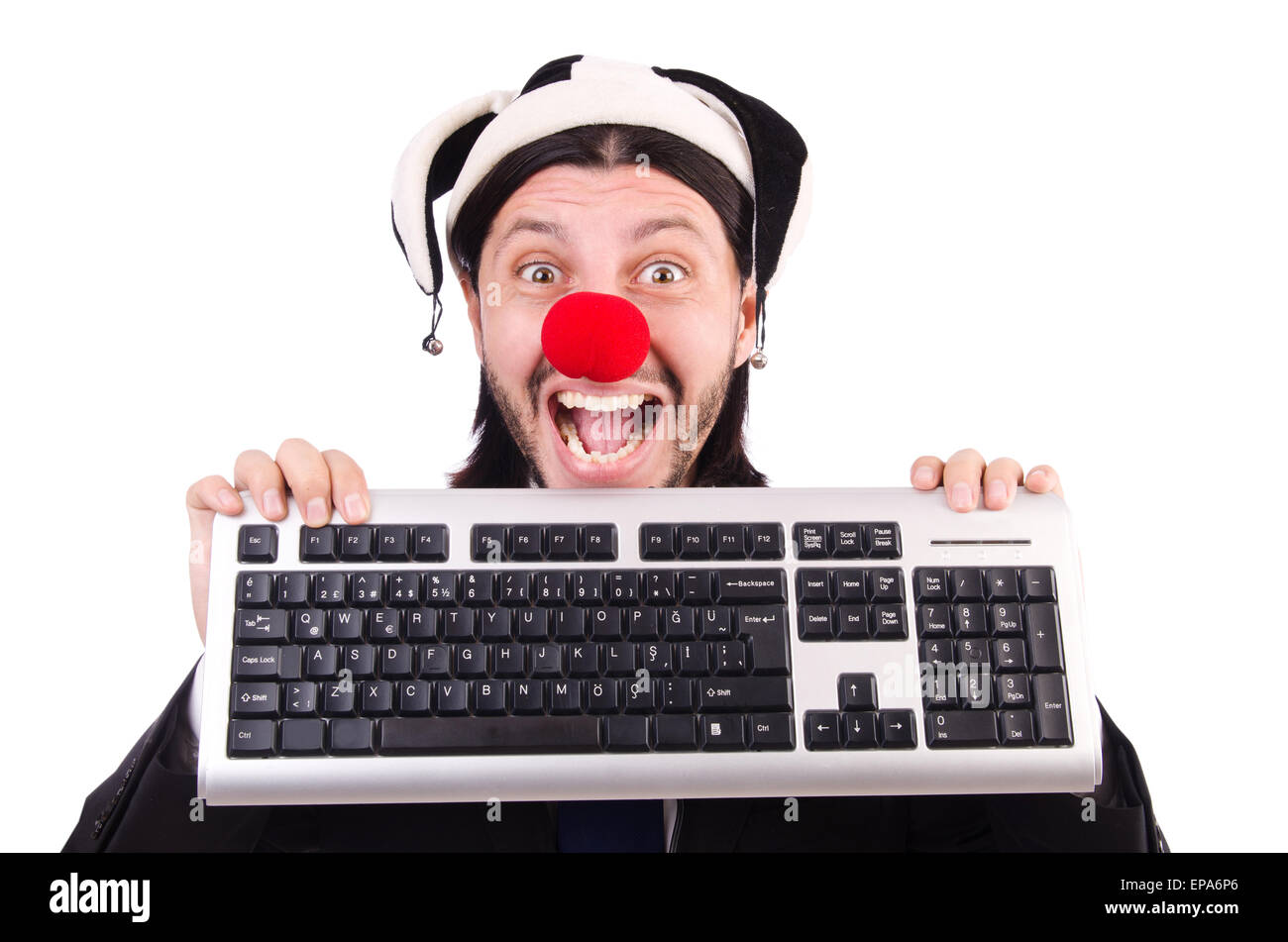 Funny clown with keyboard isolated on white Stock Photo - Alamy