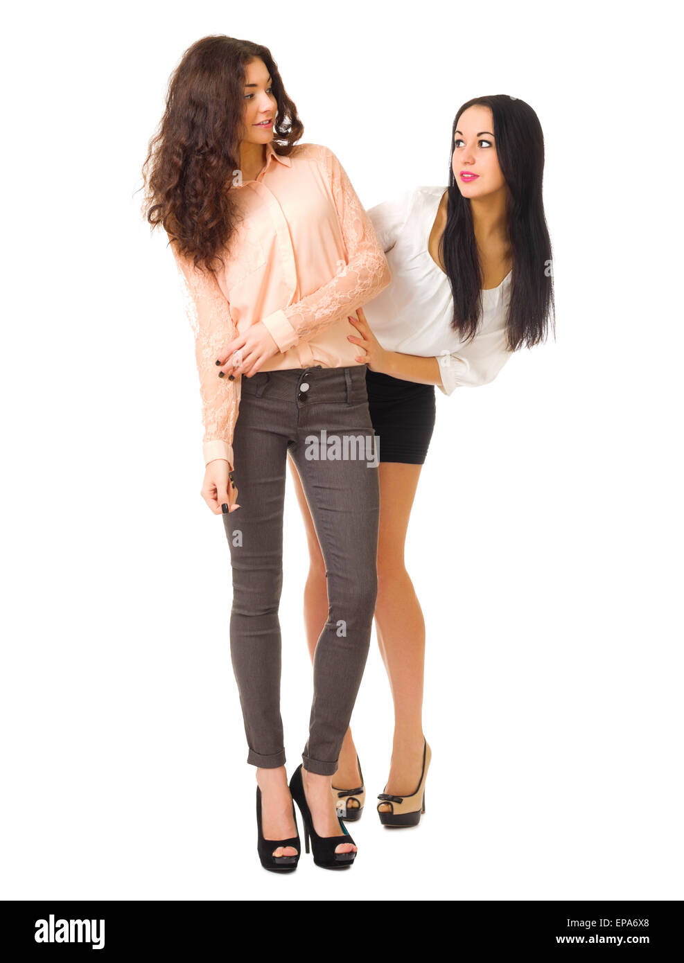 Two young girls isolated Stock Photo - Alamy